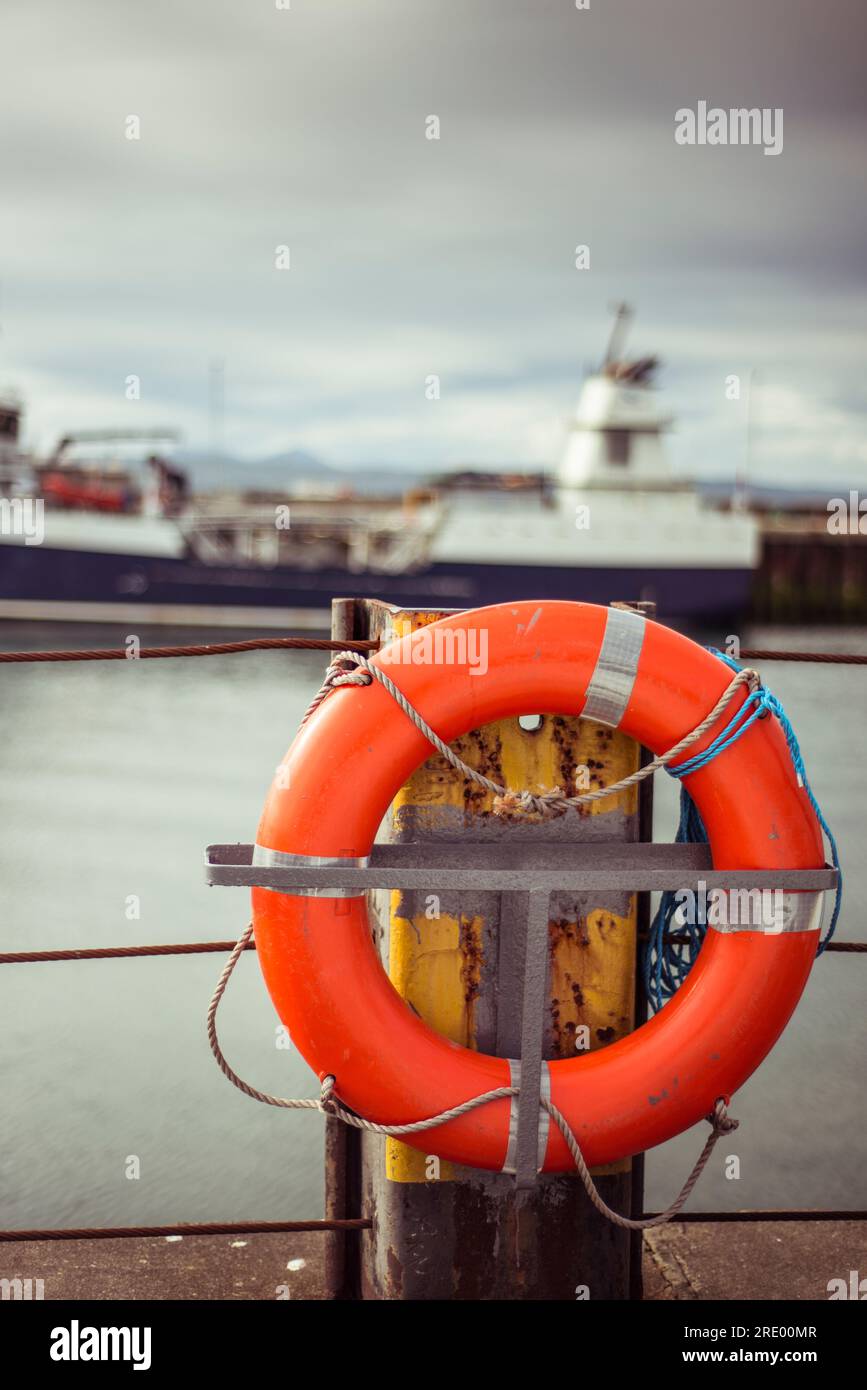 Ferry warf docklands life saving ring Stock Photo - Alamy