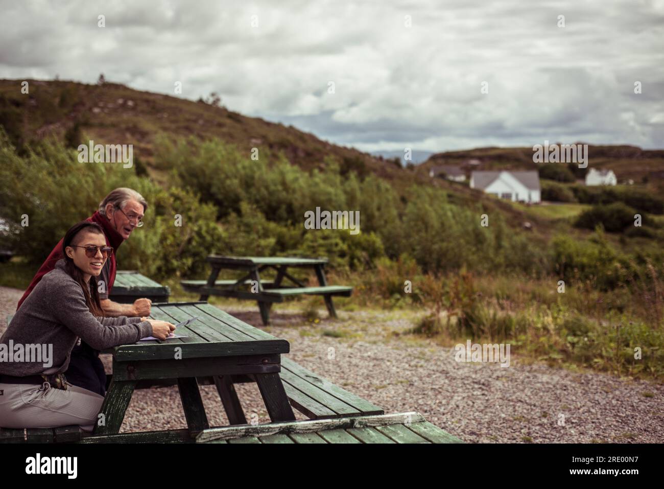 two people look out at view Scottish Highlands Stock Photo - Alamy