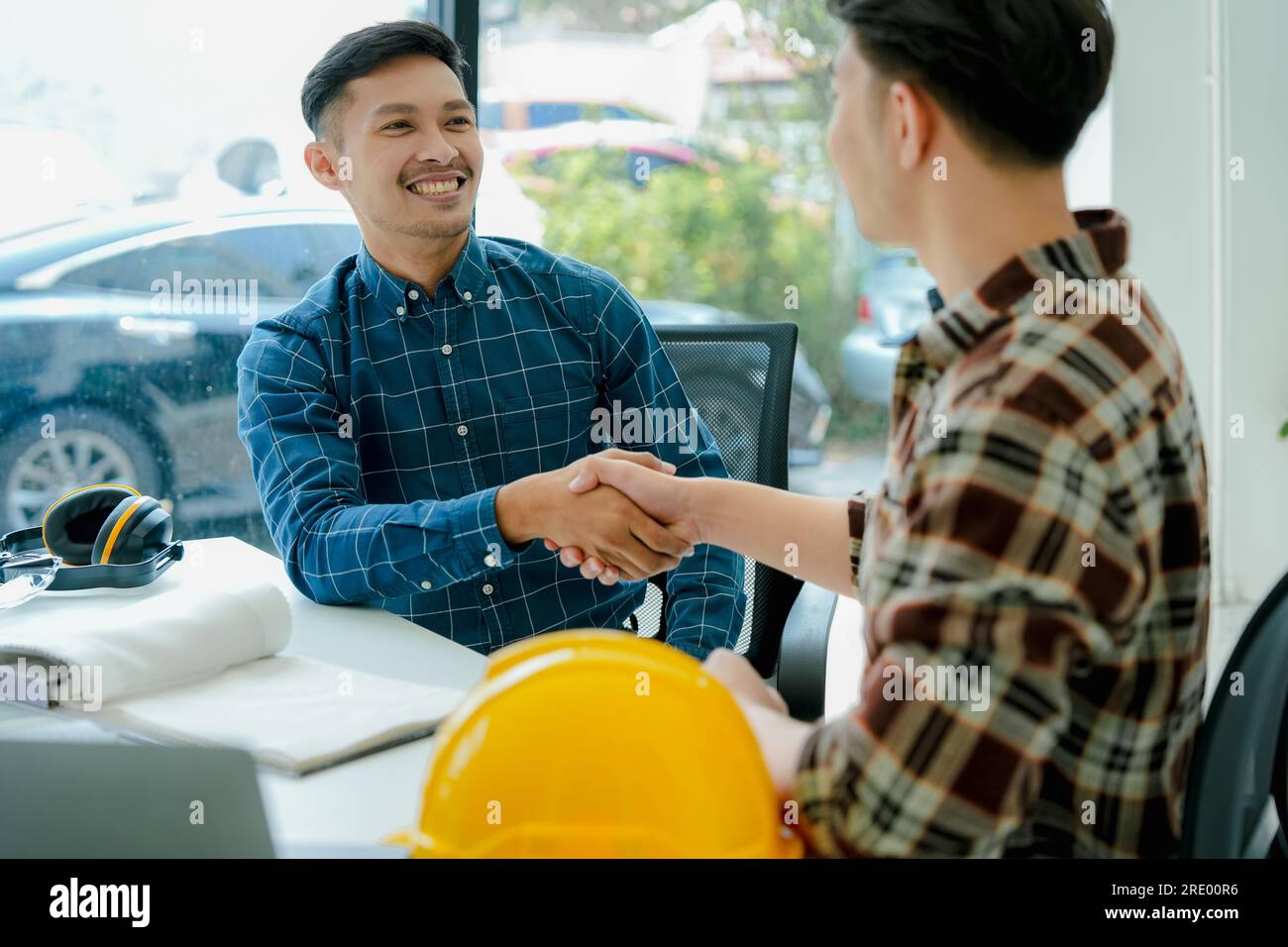 Engineers, designers and interior designers are handshake shack hands ...