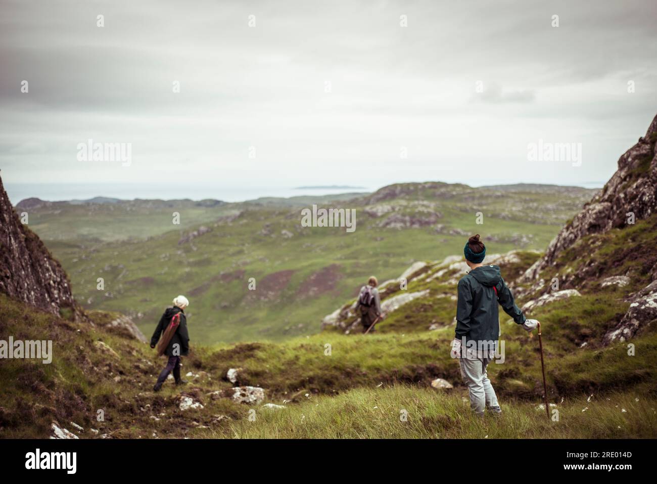 tree women hike mountain pass in Scottish highlands Stock Photo - Alamy