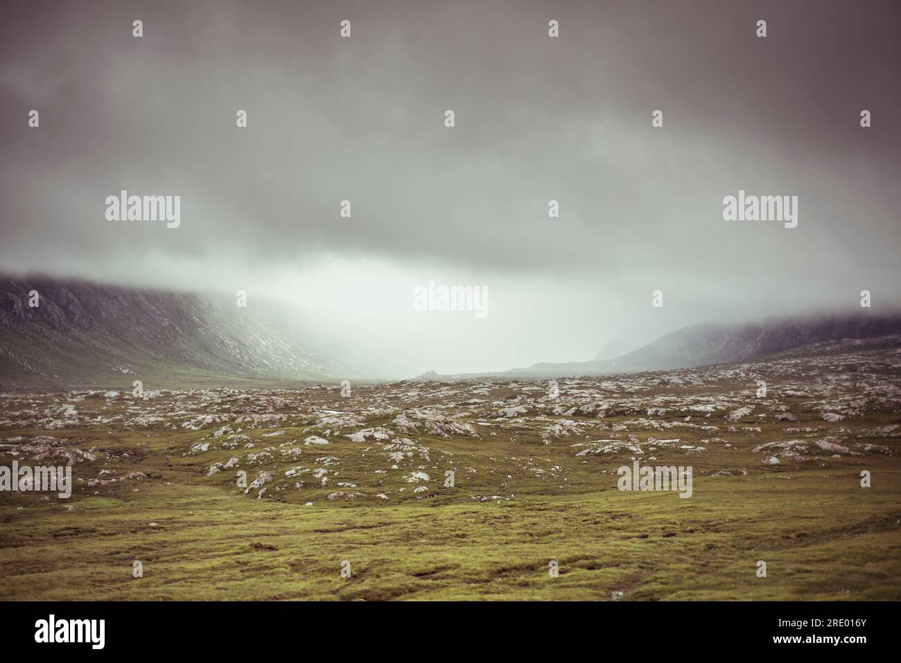 Misty moody dramatic landscape of remote mountains in scotland Stock ...