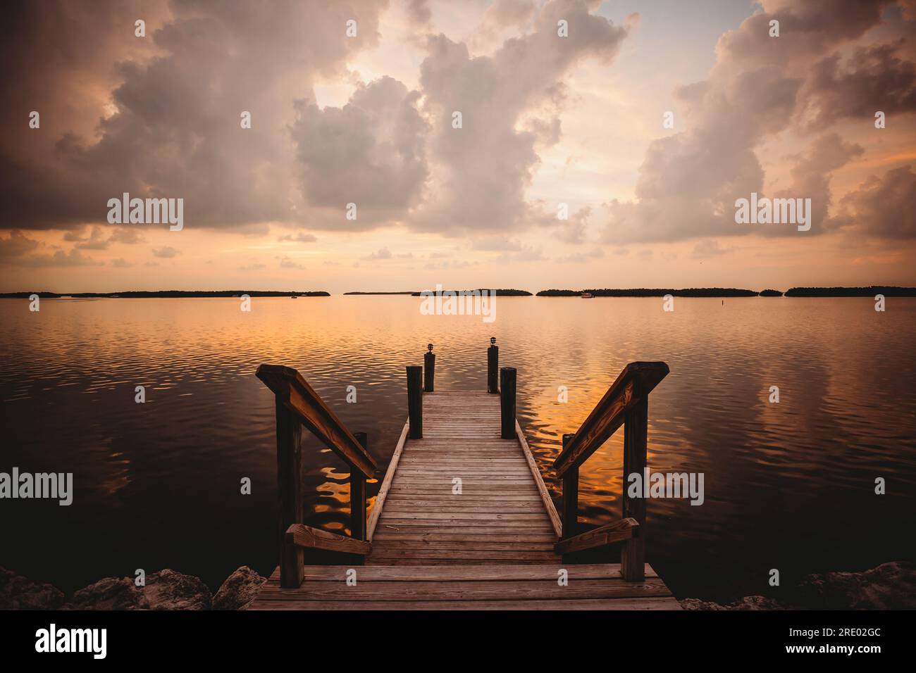 A dock at sunset in the Florida Keys is the perfect spot for relaxing ...