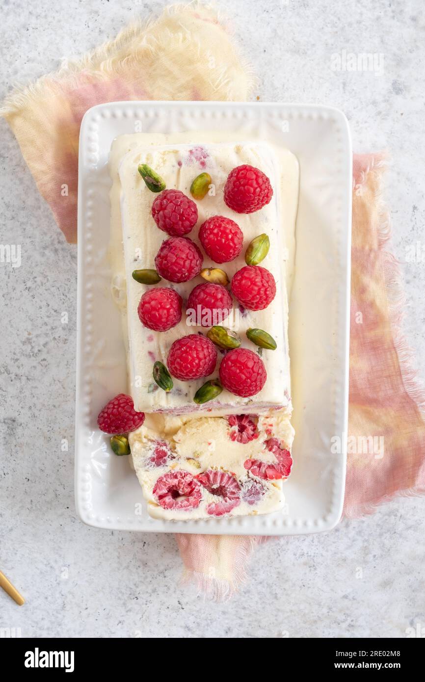 semifreddo, italian ice cream dessert, with raspberry and pistachios ...