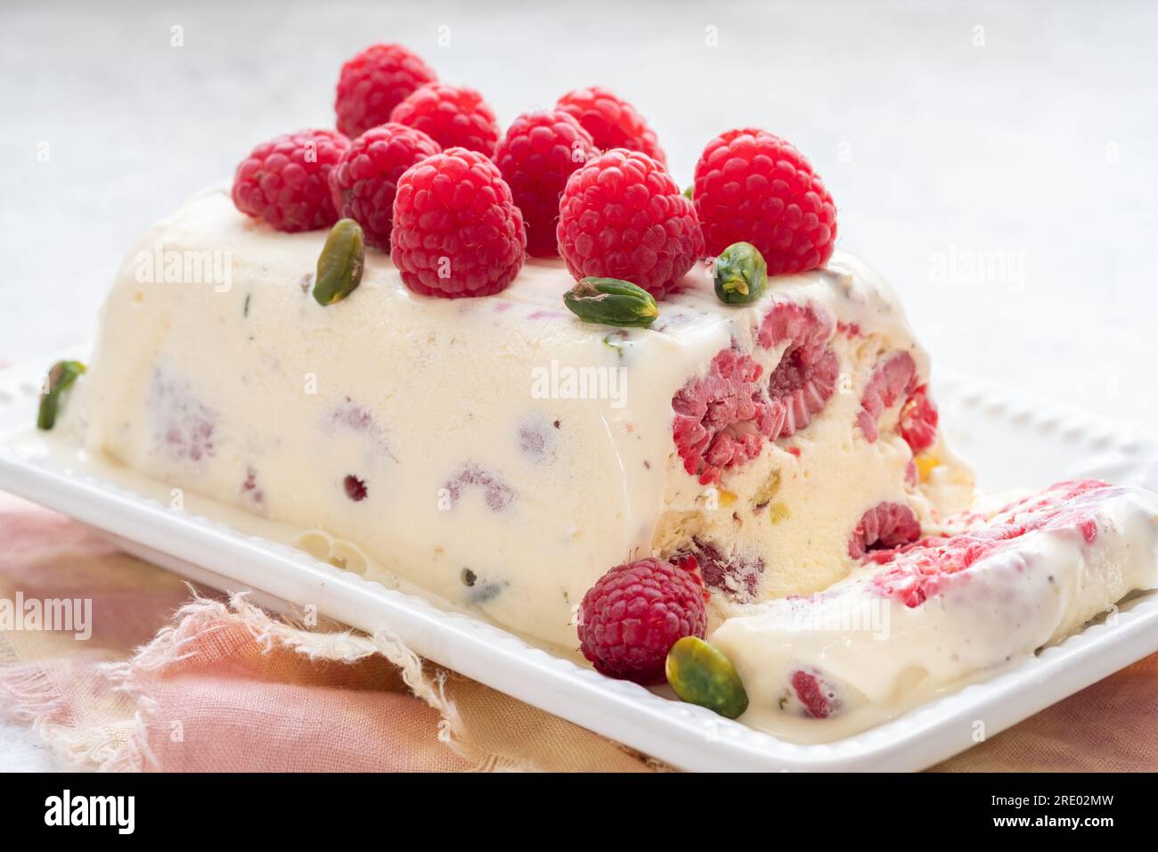 semifreddo, italian ice cream dessert, with raspberry and pistachios ...
