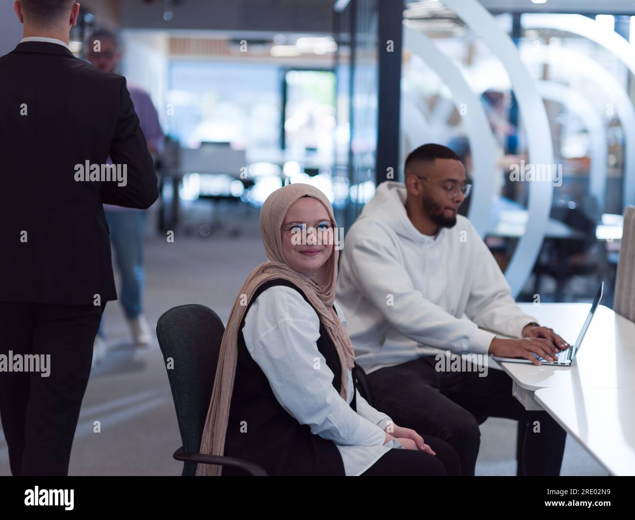 In a modern office setting, an African American businessman and his ...