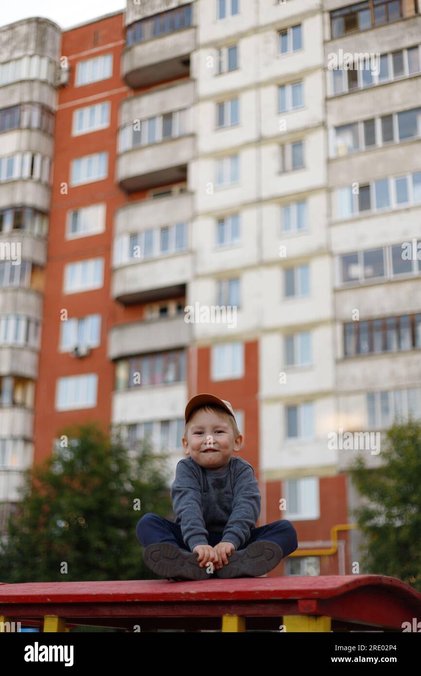 Boy sitting outdoor hi-res stock photography and images - Alamy