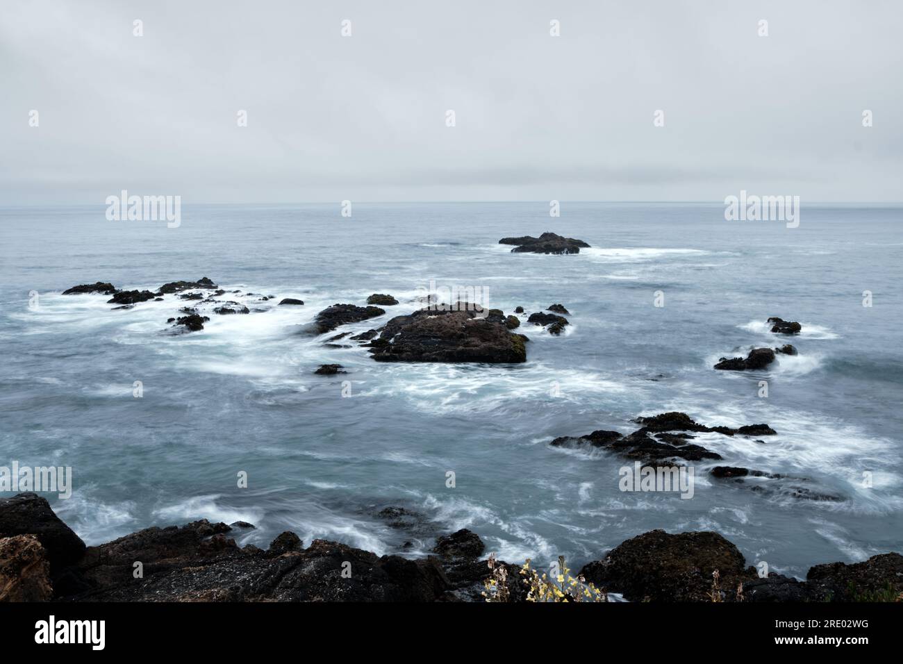 Large Jagged Rocks Amidst the Pacific on an Overcast Cold Day Stock ...
