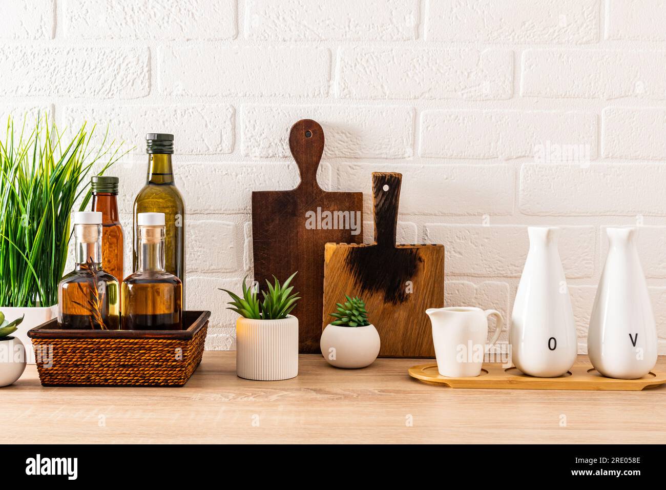 Beautiful kitchen backdrop with storage area for various bottled oils ...