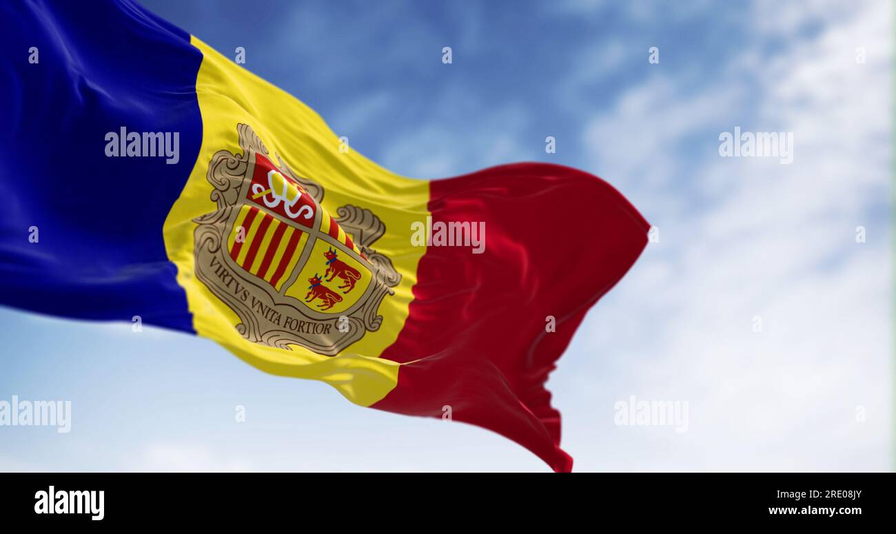 The flag of the Principality of Andorra waving in the wind on a clear ...