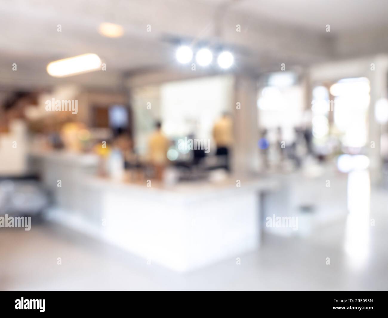 Abstract blurred modern white cafe workspace background with counter ...