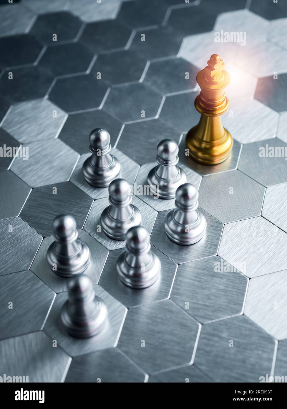 The golden king chess piece standing in front of silver pawn chess ...