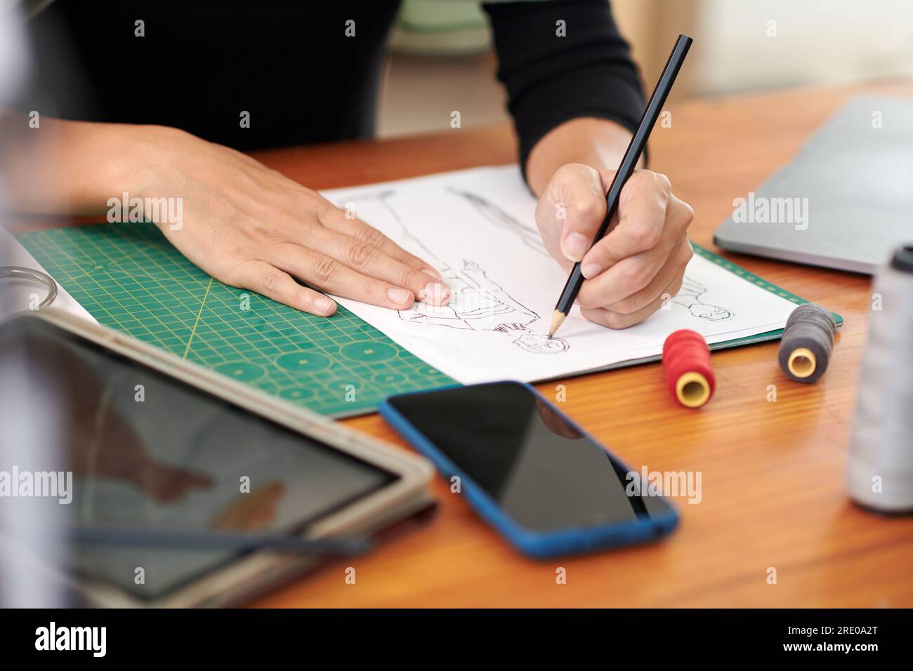 Closeup image of creative fashion designer drawing sketch Stock Photo ...