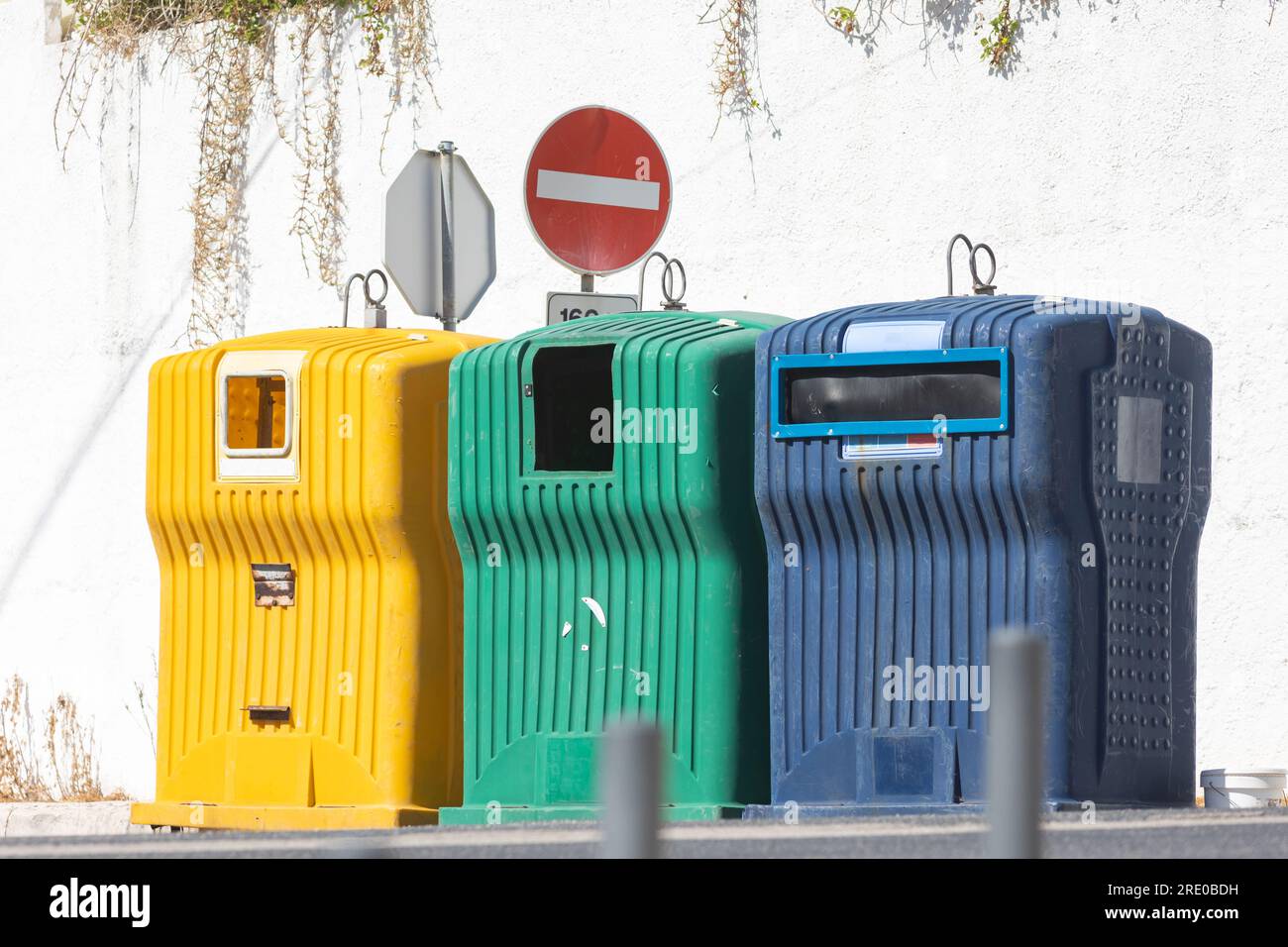 Three multi-colored garbage cans for sorted garbage outdoors Stock ...