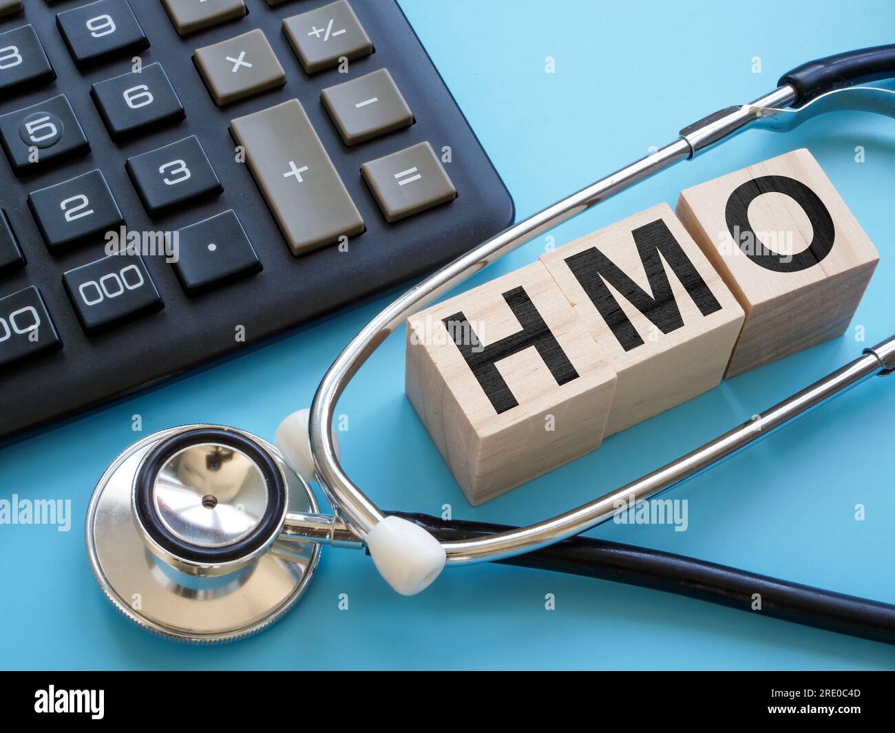 Stethoscope and cubes with letters HMO Health Maintenance Organization ...