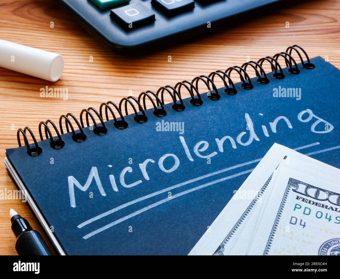 Written word microlending in the notepad and cash Stock Photo - Alamy