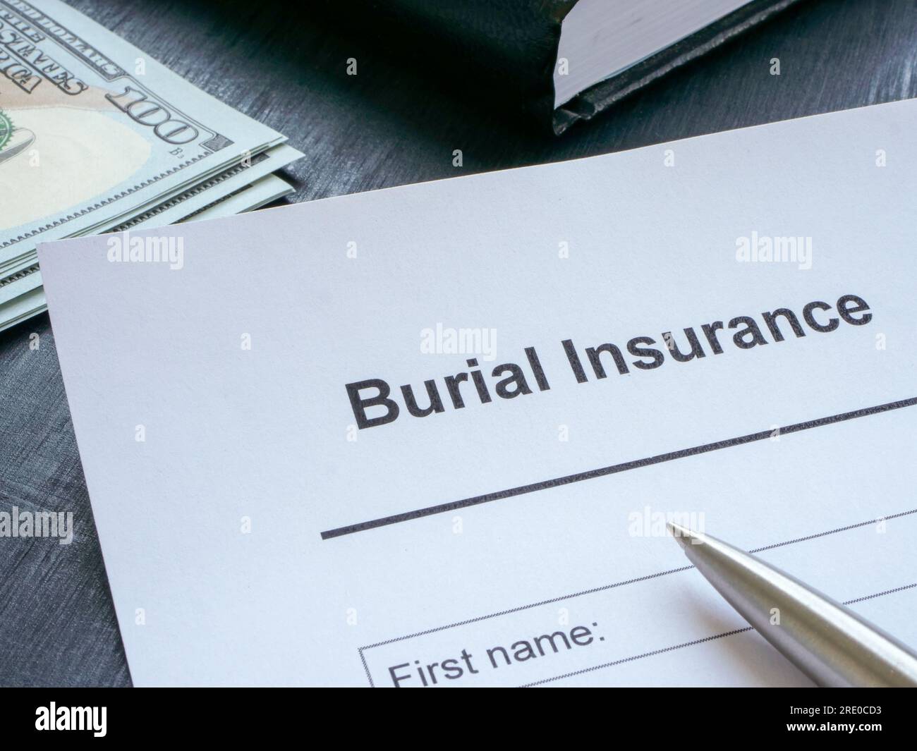 Empty burial insurance application and cash Stock Photo - Alamy