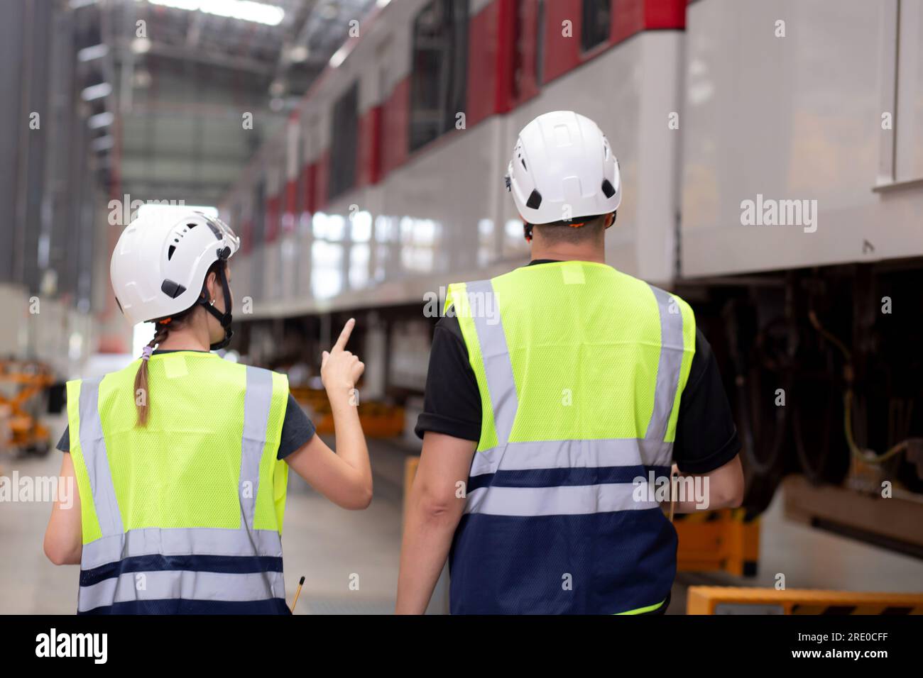 Young caucasian engineer man and woman meeting and checking electric ...