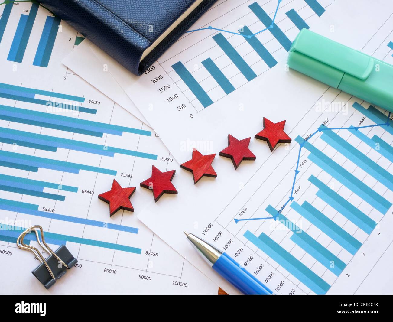 Business graphs and five stars as symbol of high rating on them Stock ...
