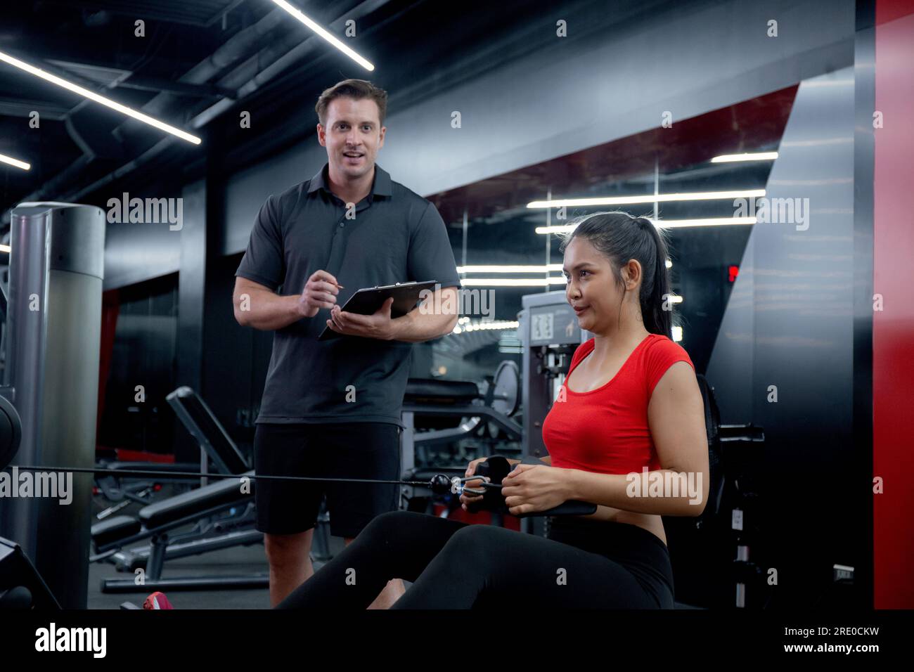 Coach man guiding workout with hands muscles stretch with equipment ...