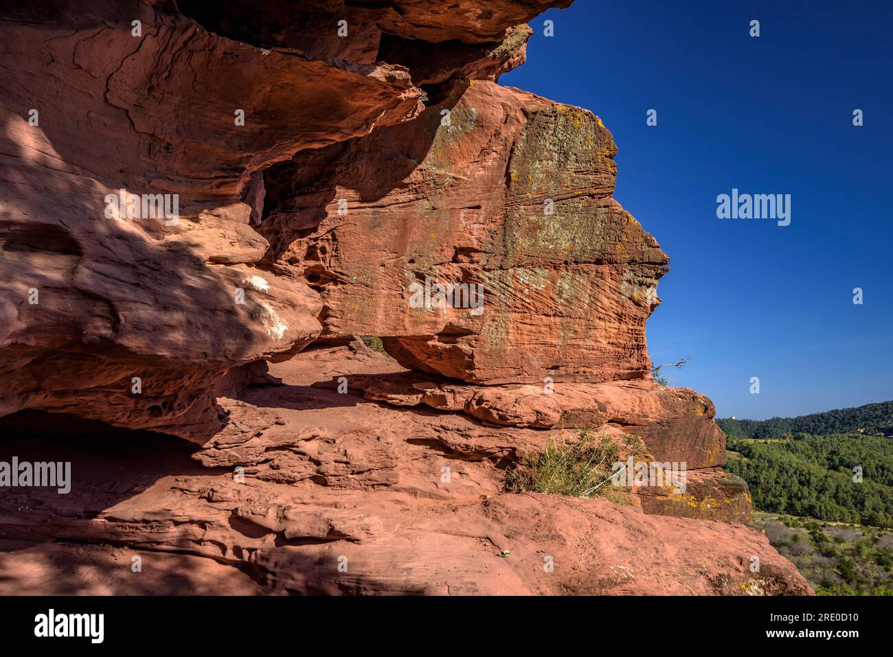 Can Riera caves and its surroundings, formed by the erosion of reddish ...
