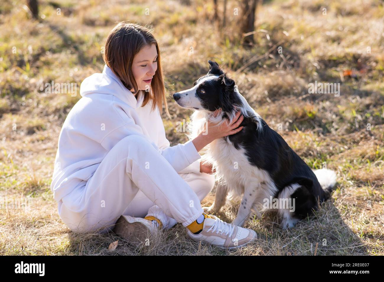 Pretty woman kissing border collie hi-res stock photography and images ...