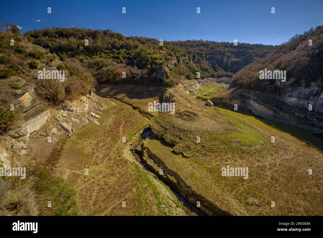 Salt del Cabrit waterfall and surroundings with the dry Sau reservoir ...