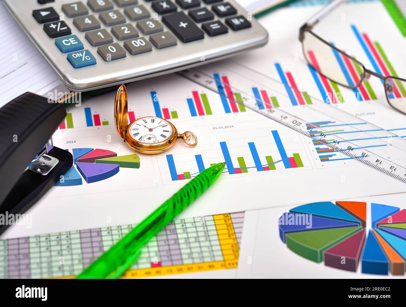 business charts, pen and gold pocket watch Stock Photo - Alamy
