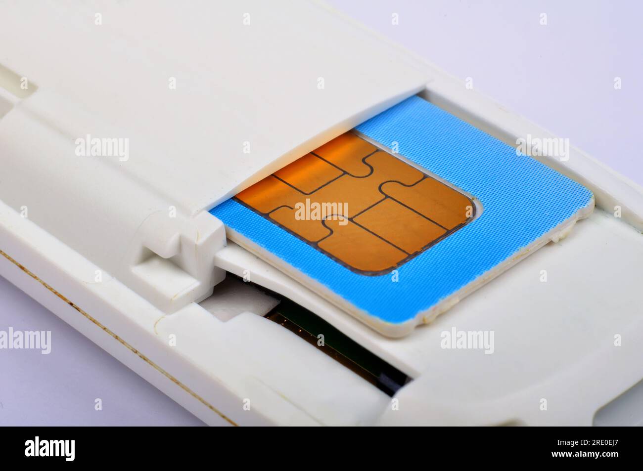 blue sim card in modem isolated on white background Stock Photo - Alamy