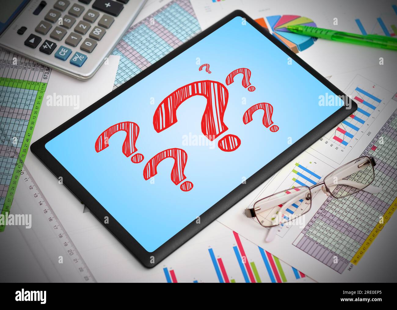 tablen with question marks and financial statements on table Stock ...