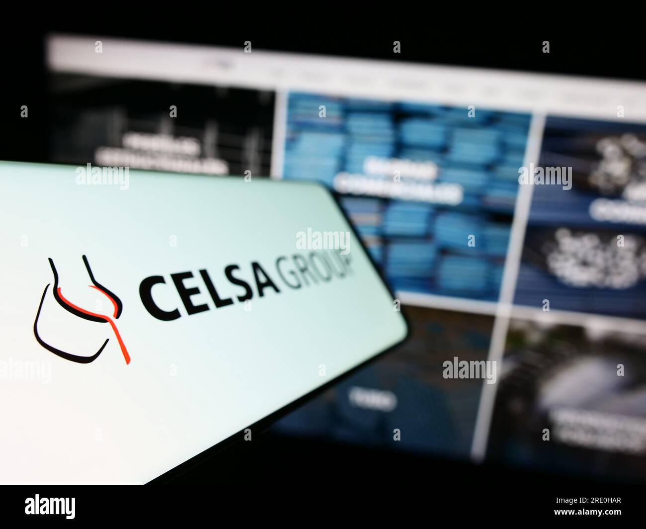 Mobile phone with logo of Spanish steel company CELSA Group on screen in front of business ...