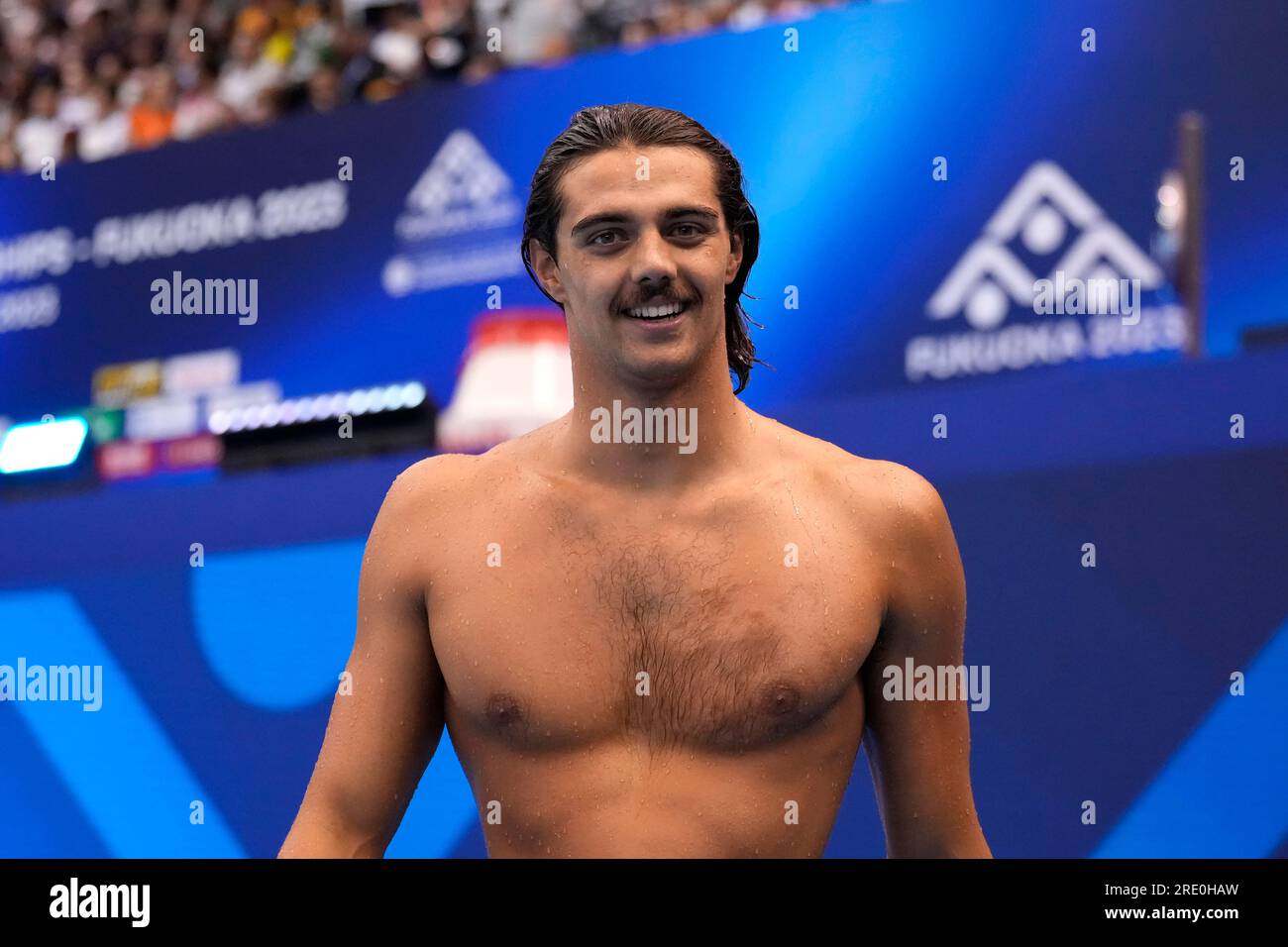 Thomas Ceccon of Italy smiles as he leaves after winning the men's 50m butterfly final at the ...