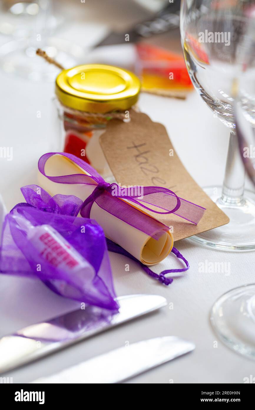 Purple themed Wedding favours - sweets in an Organza bag, a scroll with ...