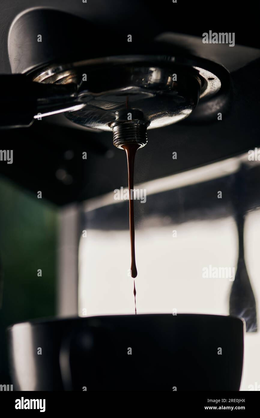 coffee extraction, drops, hot beverage, espresso dripping into cup ...