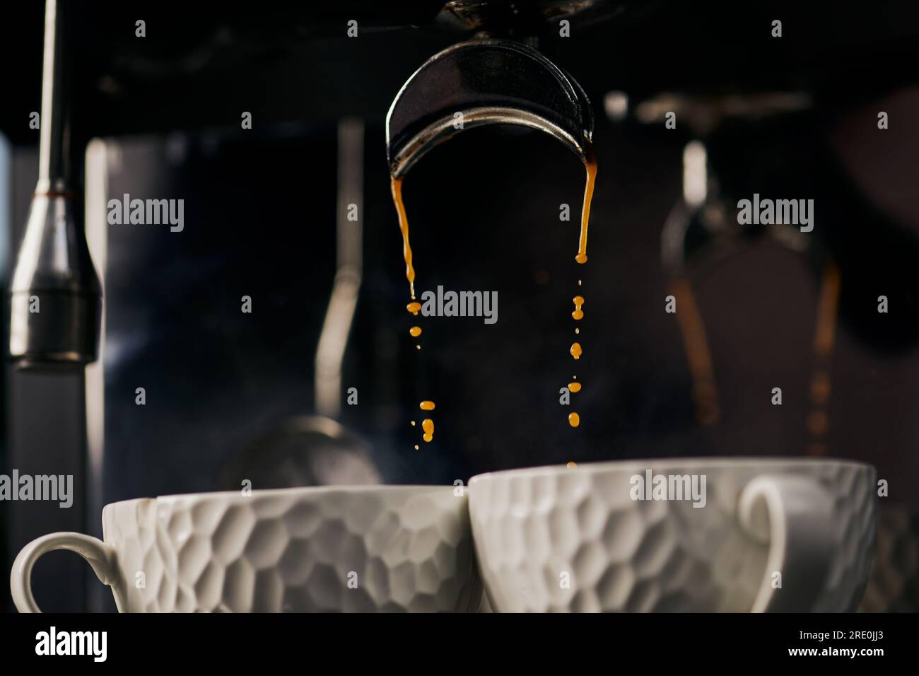 coffee extraction, drops, hot beverage, espresso dripping into cups ...