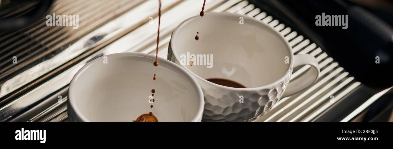 coffee extraction, hot beverage, espresso dripping into cups ...