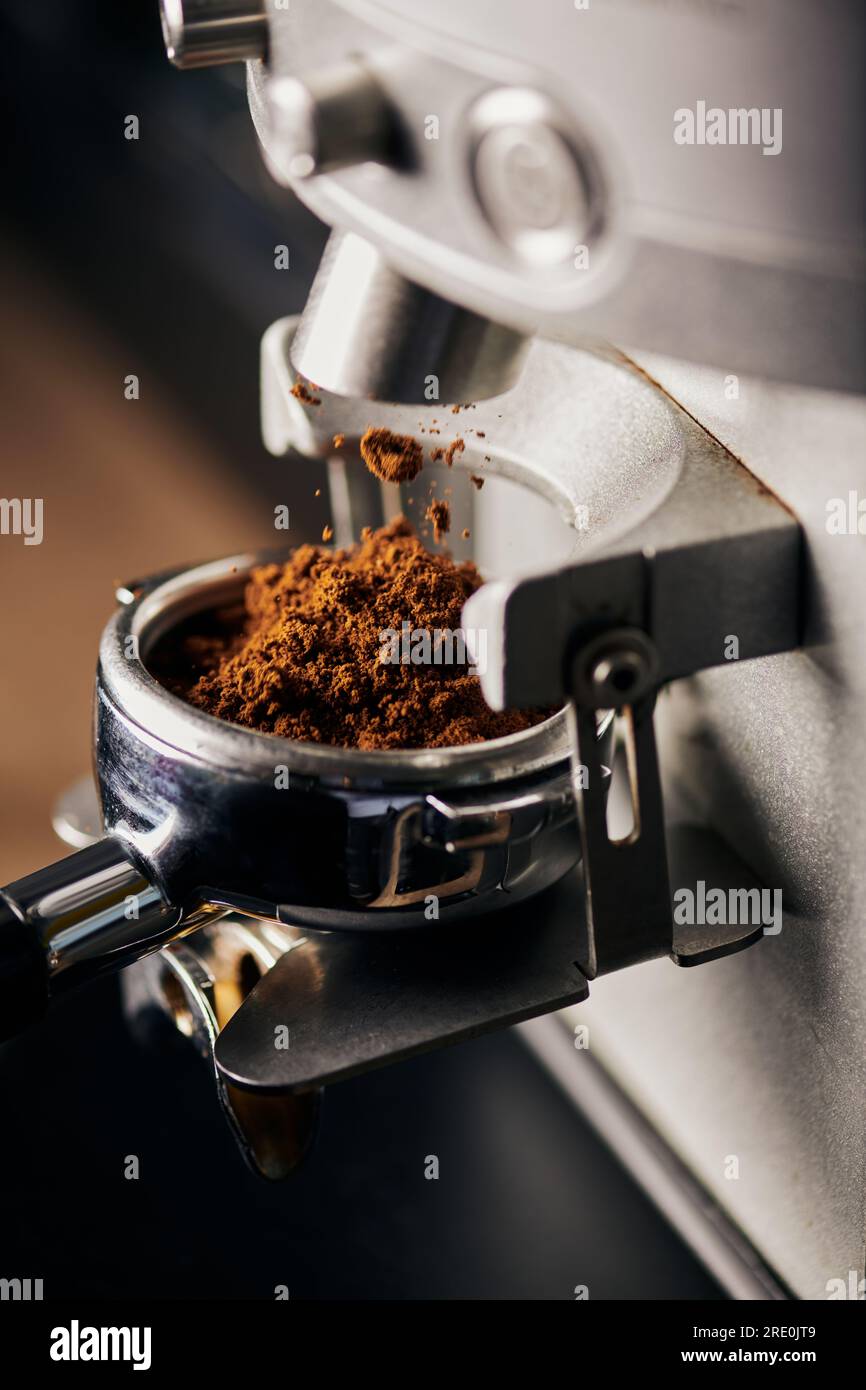 grinded coffee in portafilter, coffee machine, close up, coffee extraction, prepare of espresso ...