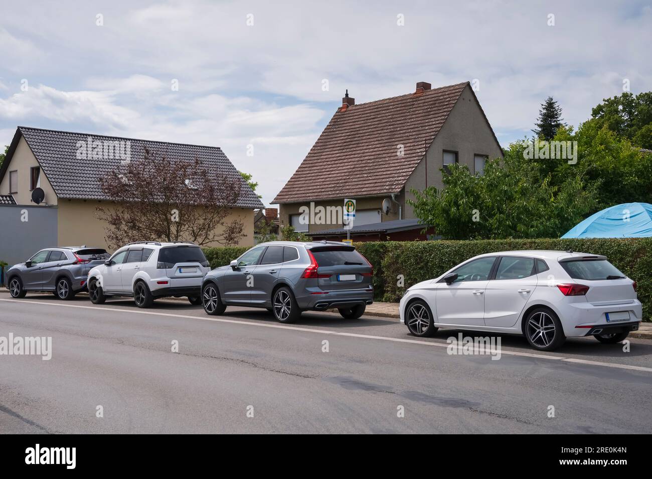 Cars parked in a bus stop in a no parking zone Stock Photo - Alamy