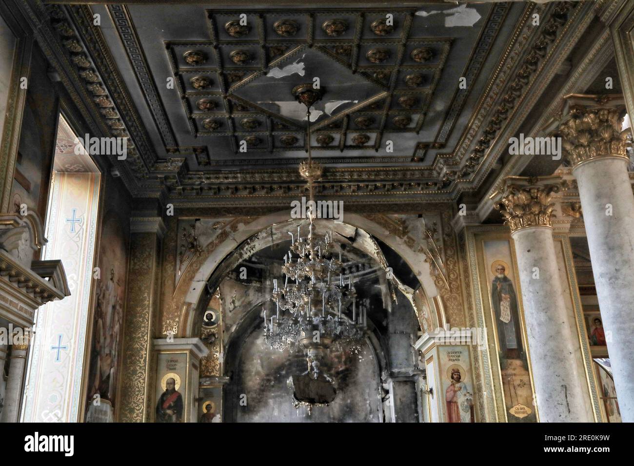 ODESA, UKRAINE - JULY 23, 2023 - A chandelier hangs from a soot-covered ...