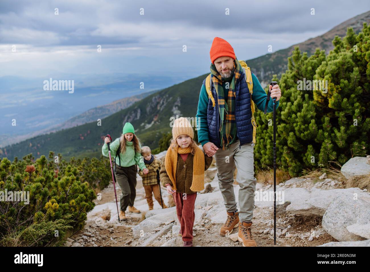 Happy family hiking together in autumn mountains Stock Photo - Alamy