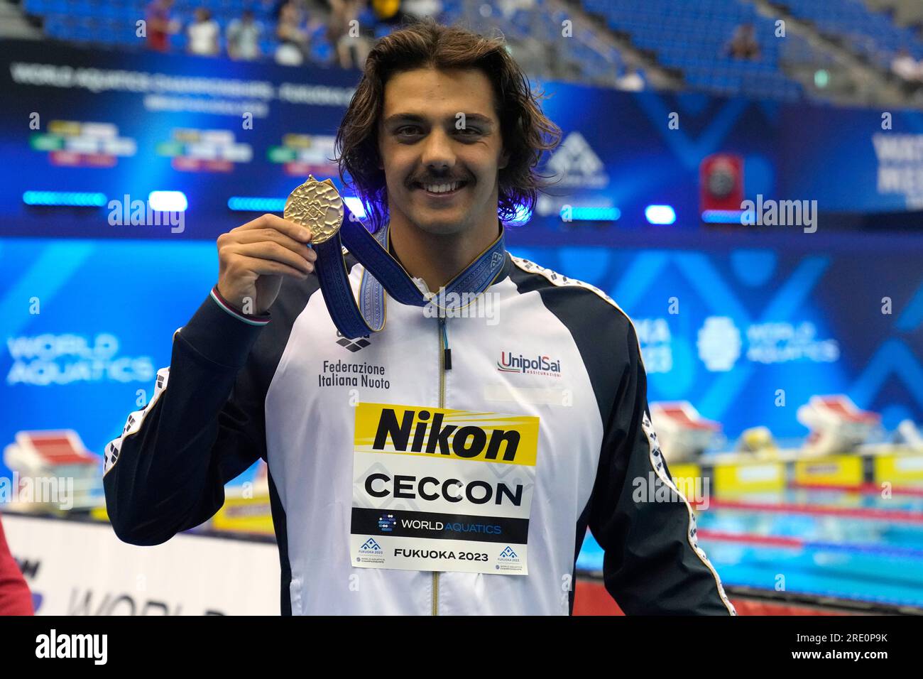 Thomas Ceccon of Italy poses with his gold medal after winning the men's 50m butterfly final at ...