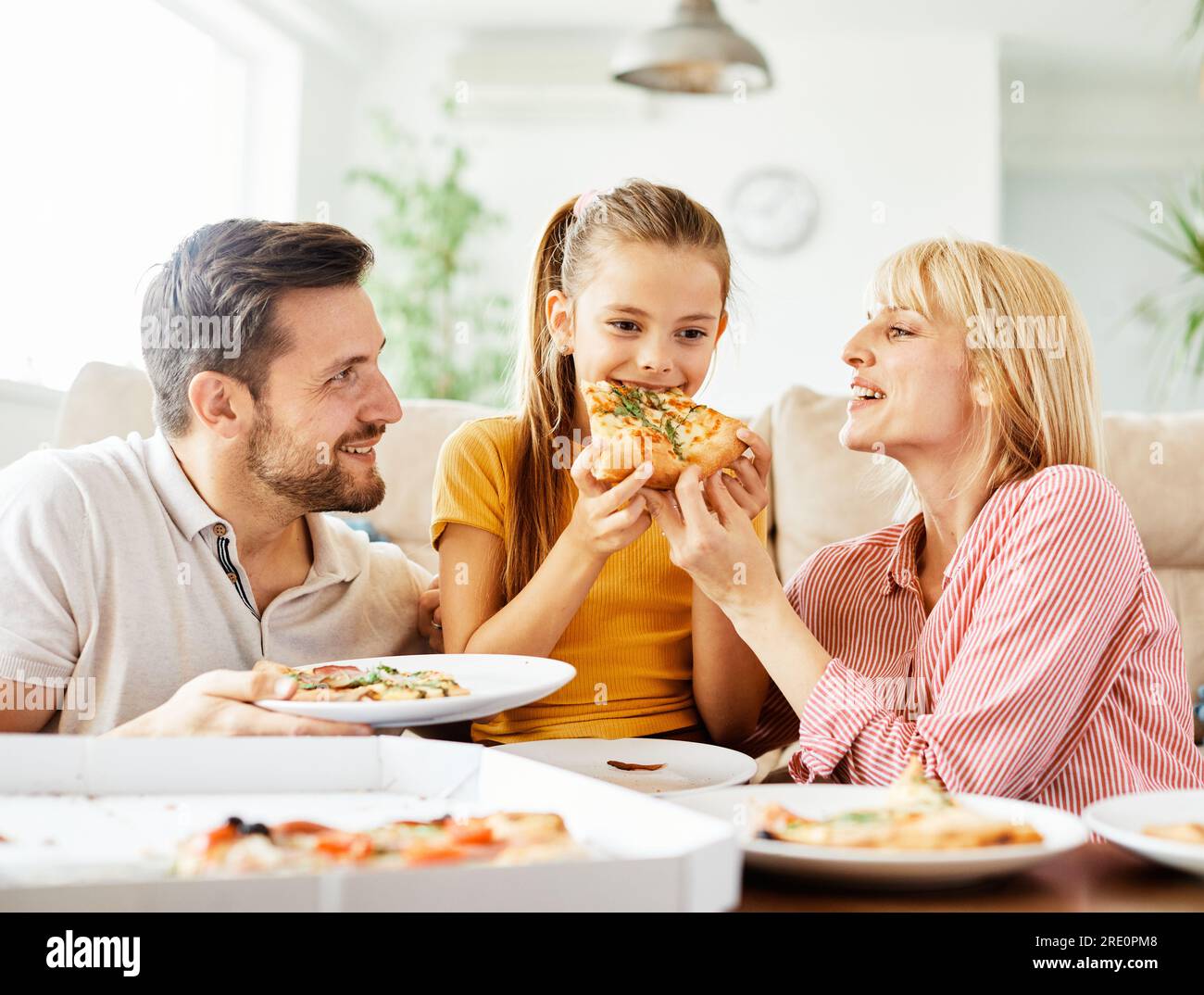 pizza family child food home eating daughter mother father happy meal ...