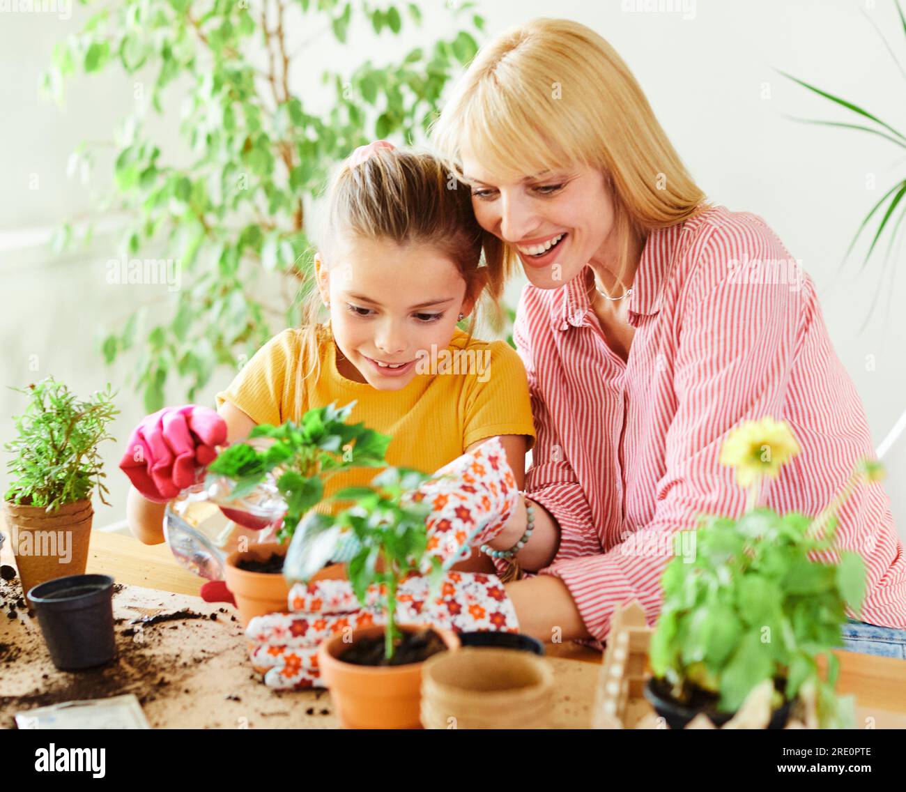 child mother family parent home woman flower gardening plant garden ...
