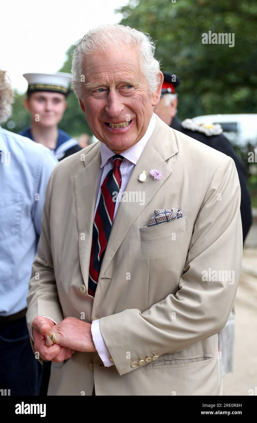 King Charles III smiles as he arrives for his visit to the Ulceby ...