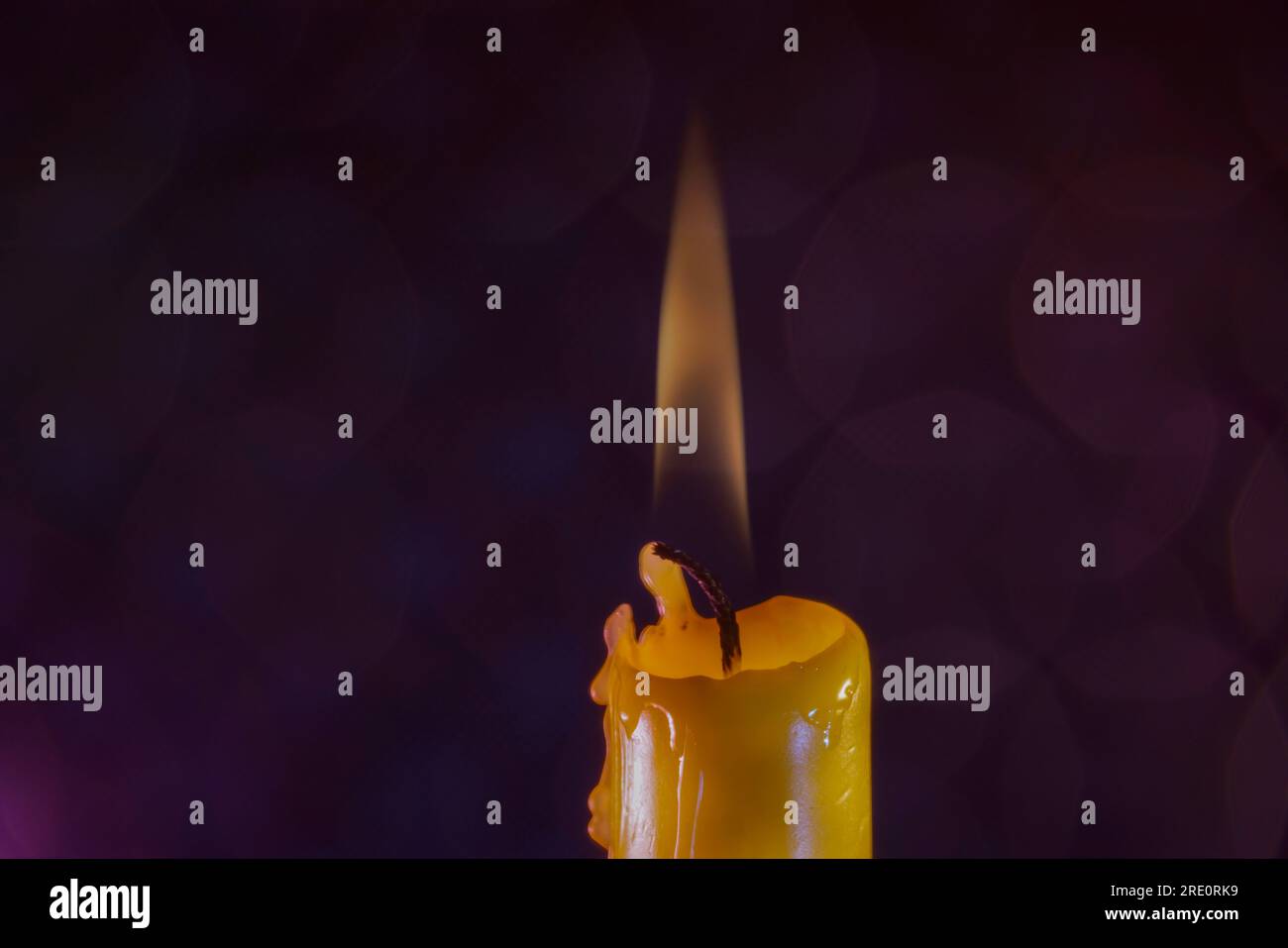 candle with smoke and flame photographed in the studio with color foils ...