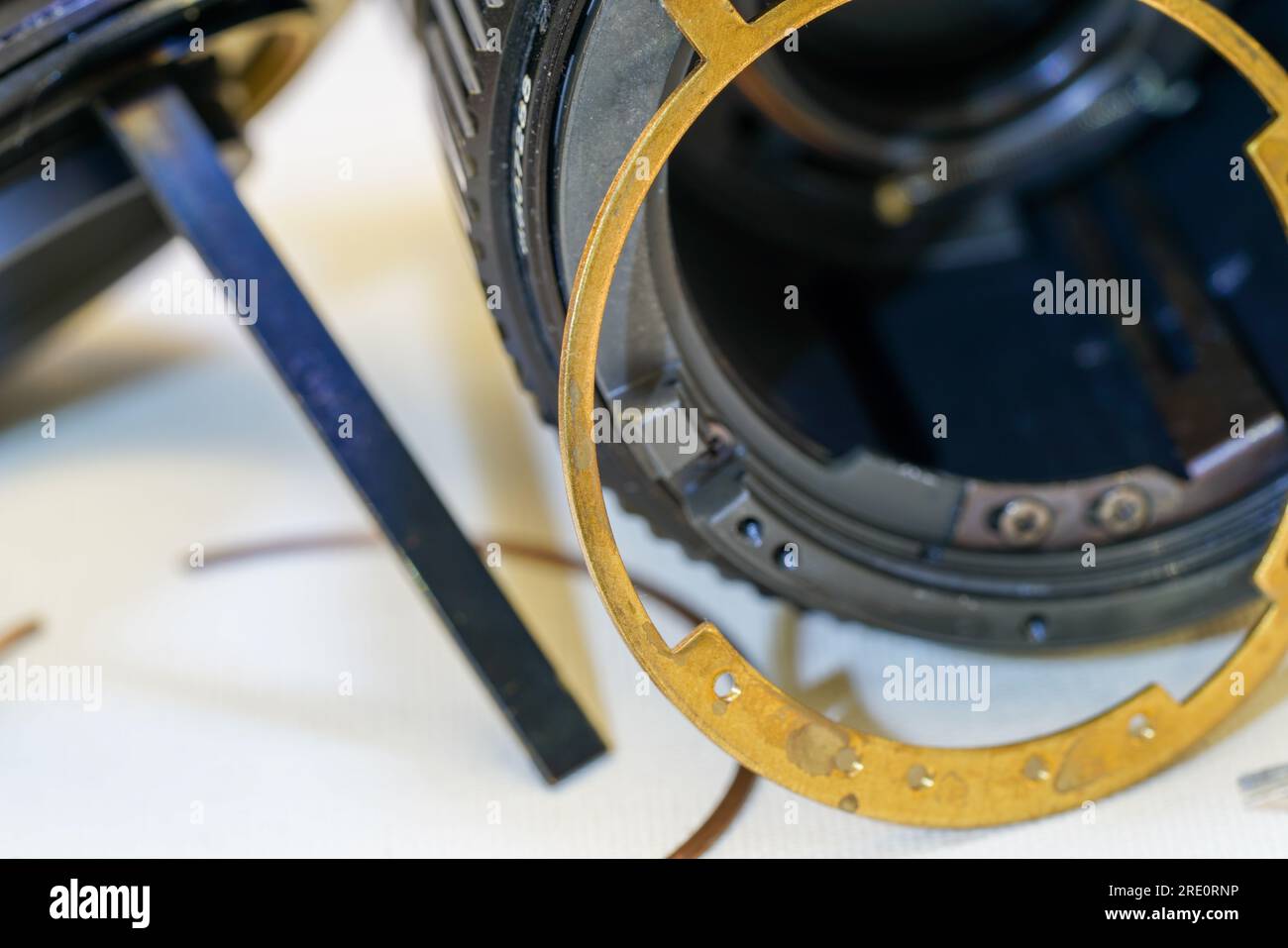 Clean and disassemble the lens for photography into its component parts ...