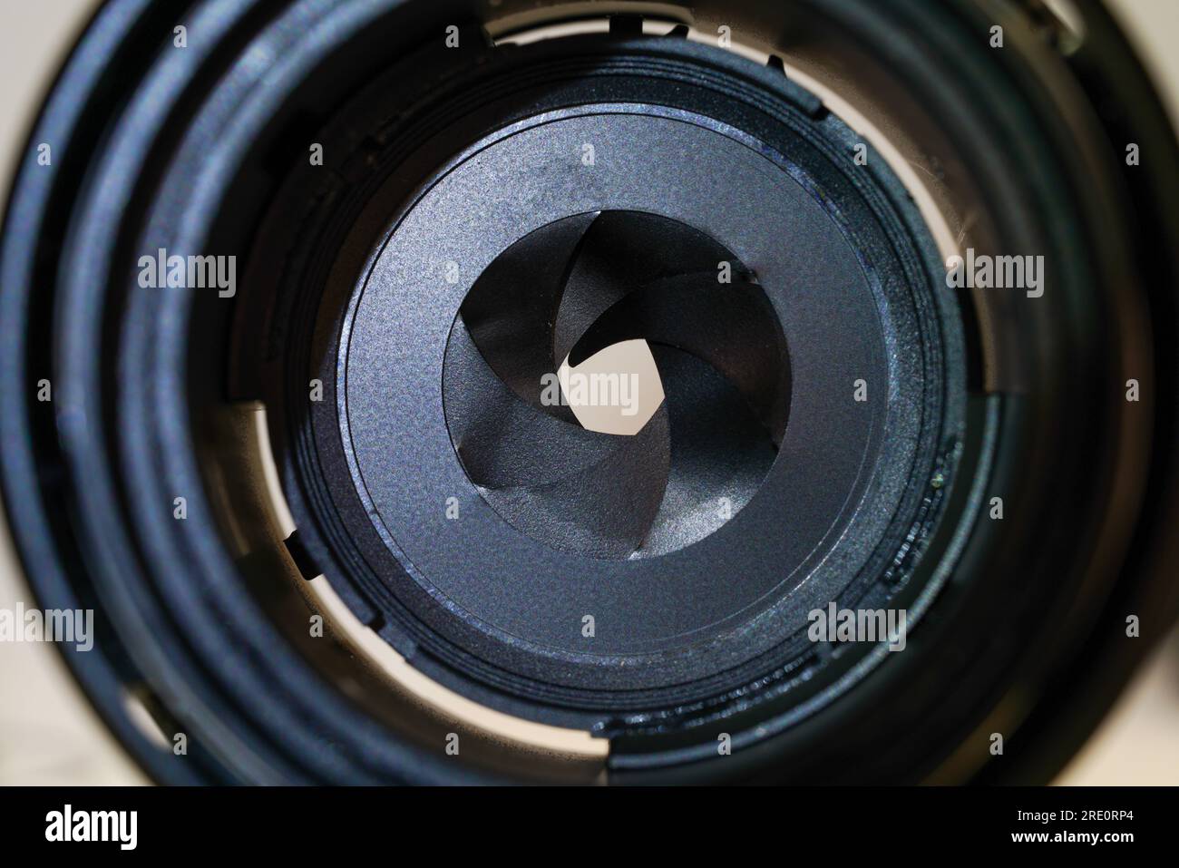 Clean and disassemble the lens for photography into its component parts ...