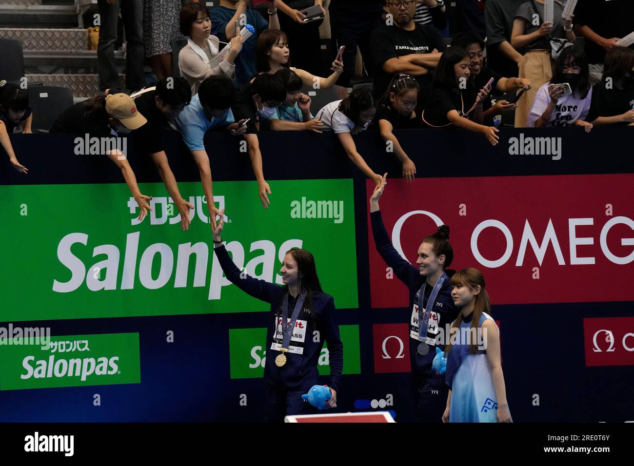 Fans reach out to greet gold medalist Kate Douglass of United States ...