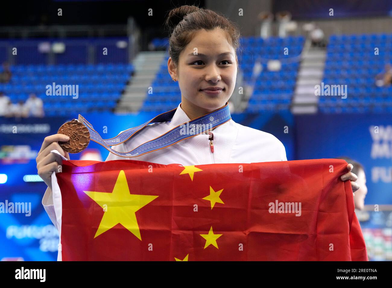 Yu Yiting of China poses with her bronze medal during the medals ceremony of the women's 200m ...
