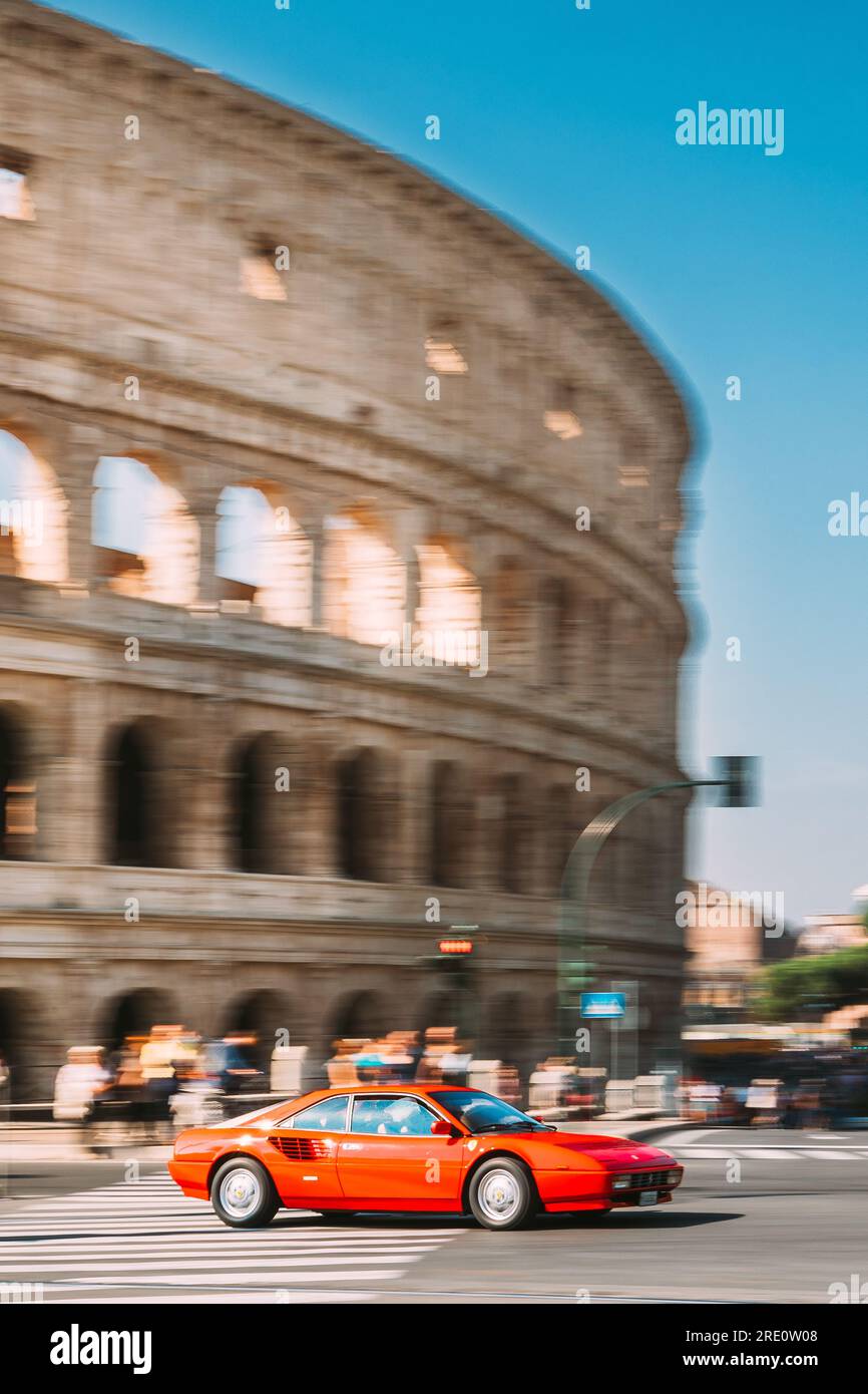 Rome, Italy. Red Ferrari Mondial Coupe In Fast Motion Near Colosseum ...