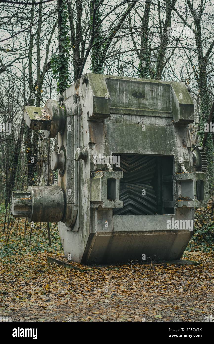 Old and rusted ore grinding machine in the forest in autumn. Abandoned ...